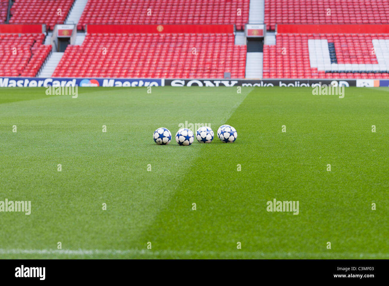 Footballs on a pitch Stock Photo - Alamy