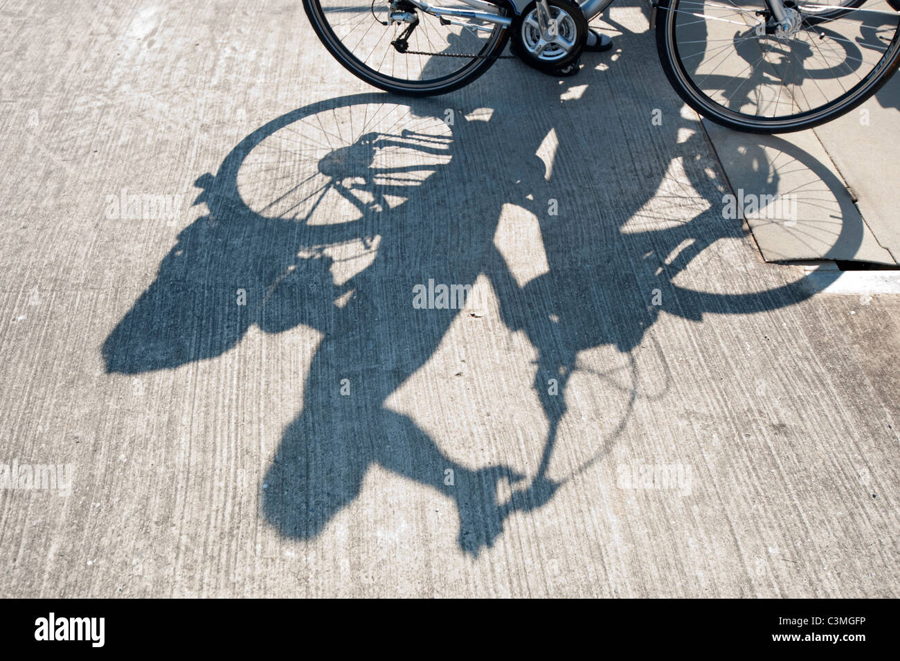 Shadow of cyclist hi-res stock photography and images - Alamy