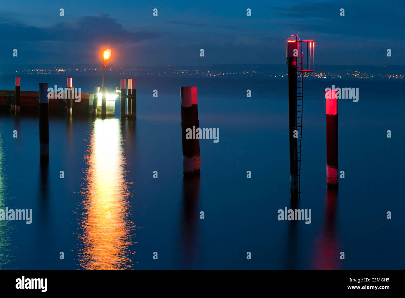Germany, Meersburg, View of navigation marks in sea at night Stock ...