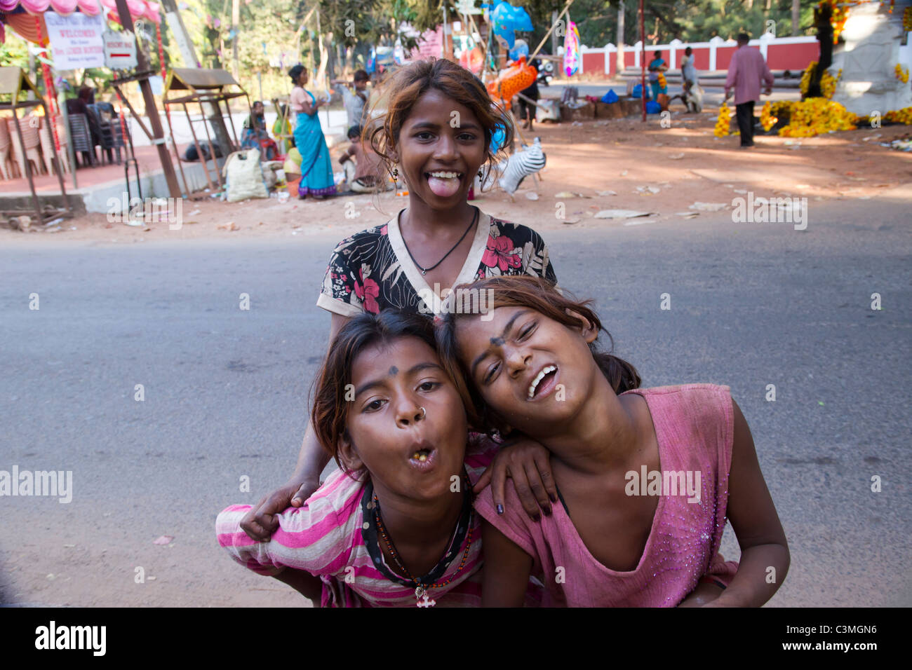 Asian children pulling faces at the camera Stock Photo - Alamy