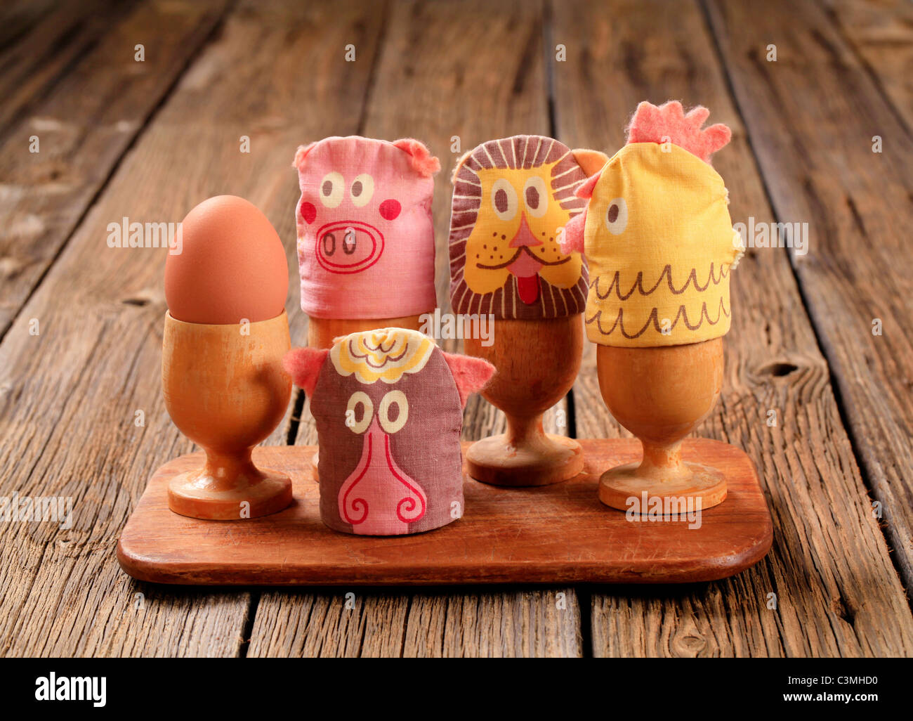 Funny animal egg cosies for boiled eggs Stock Photo - Alamy