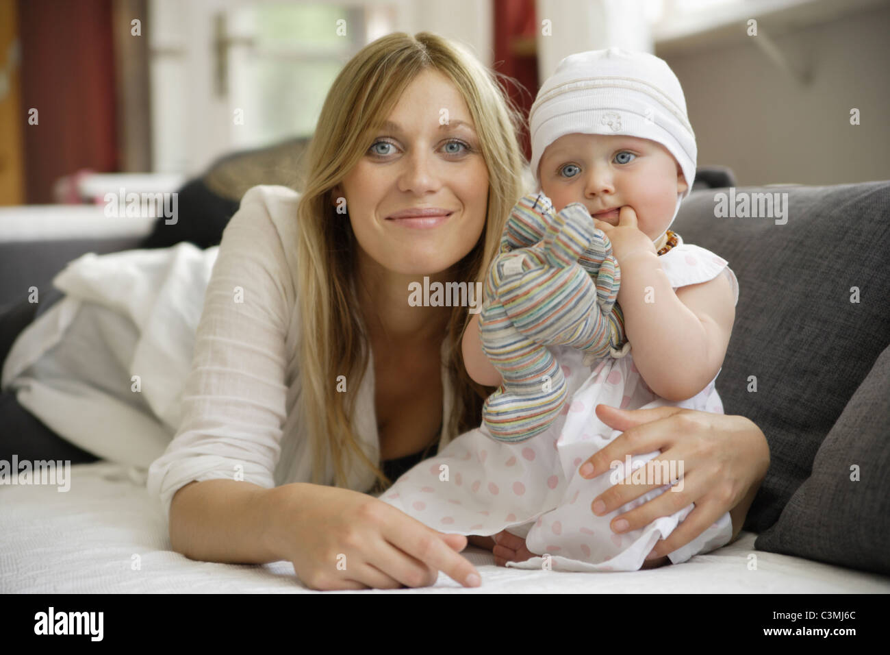Germany, Mother holding her daughter Stock Photo - Alamy