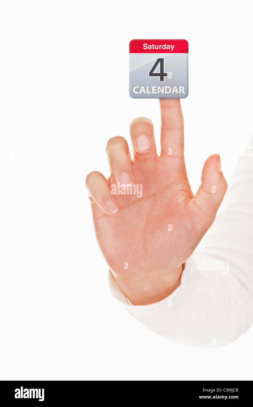 Human hand touching calendar icon Stock Photo - Alamy