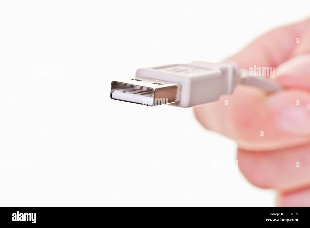 Human hand holding USB cable, close-up Stock Photo - Alamy
