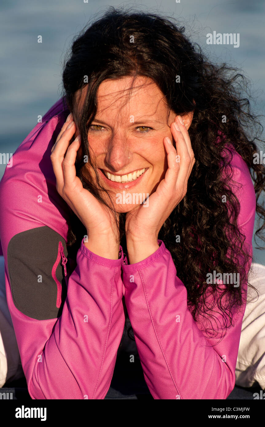 Mid adult woman on jetty, smiling, portrait Stock Photo - Alamy