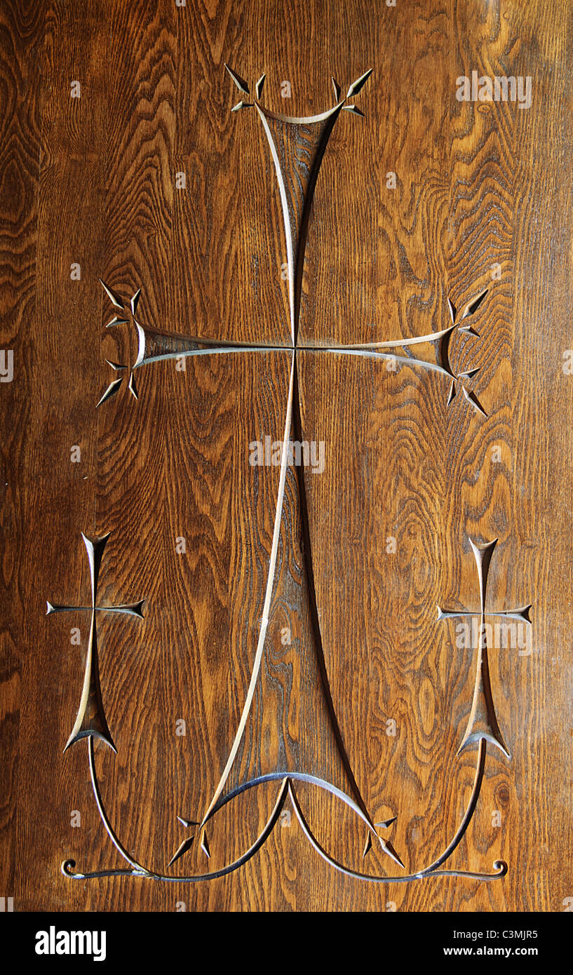 The three crosses engraved in a wooden door of an ancient church Stock ...
