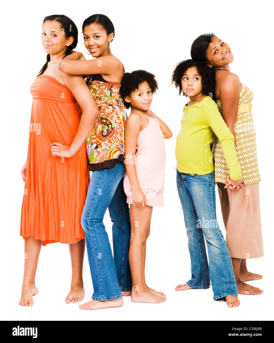 Smiling friends standing together and posing isolated over white Stock ...