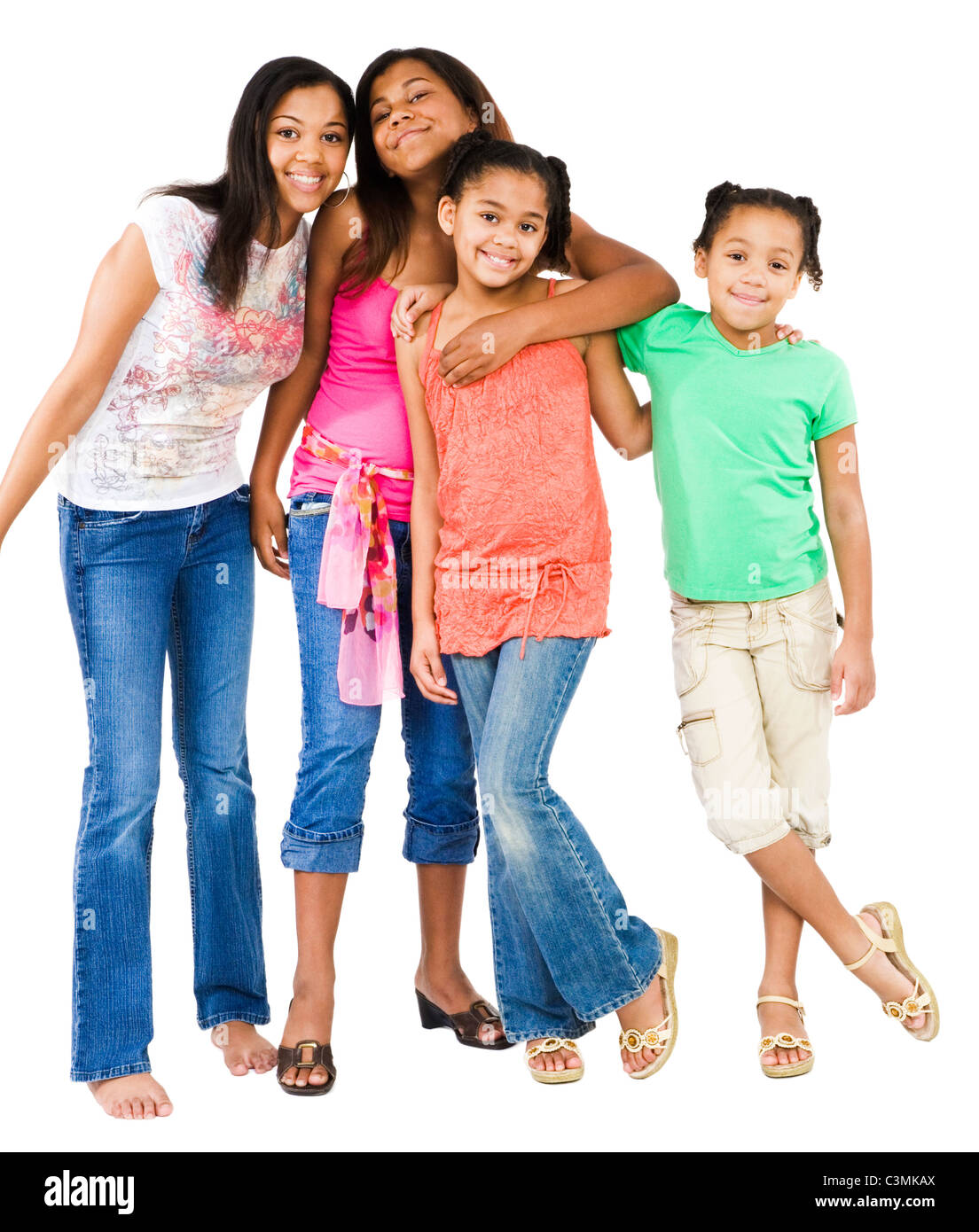 Portrait of four friends standing together isolated over white Stock ...