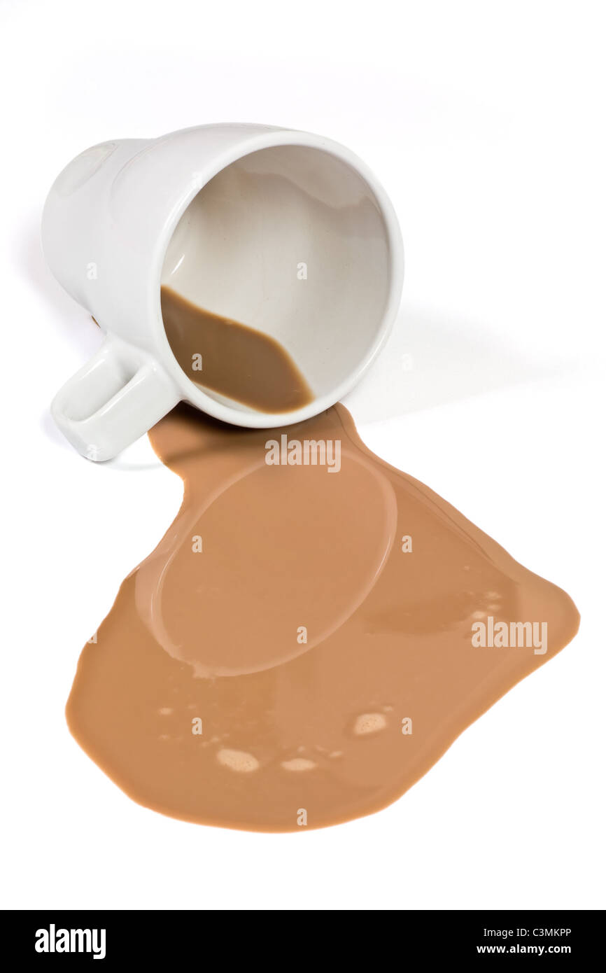 White cup with some spilled chocolate milk Stock Photo - Alamy