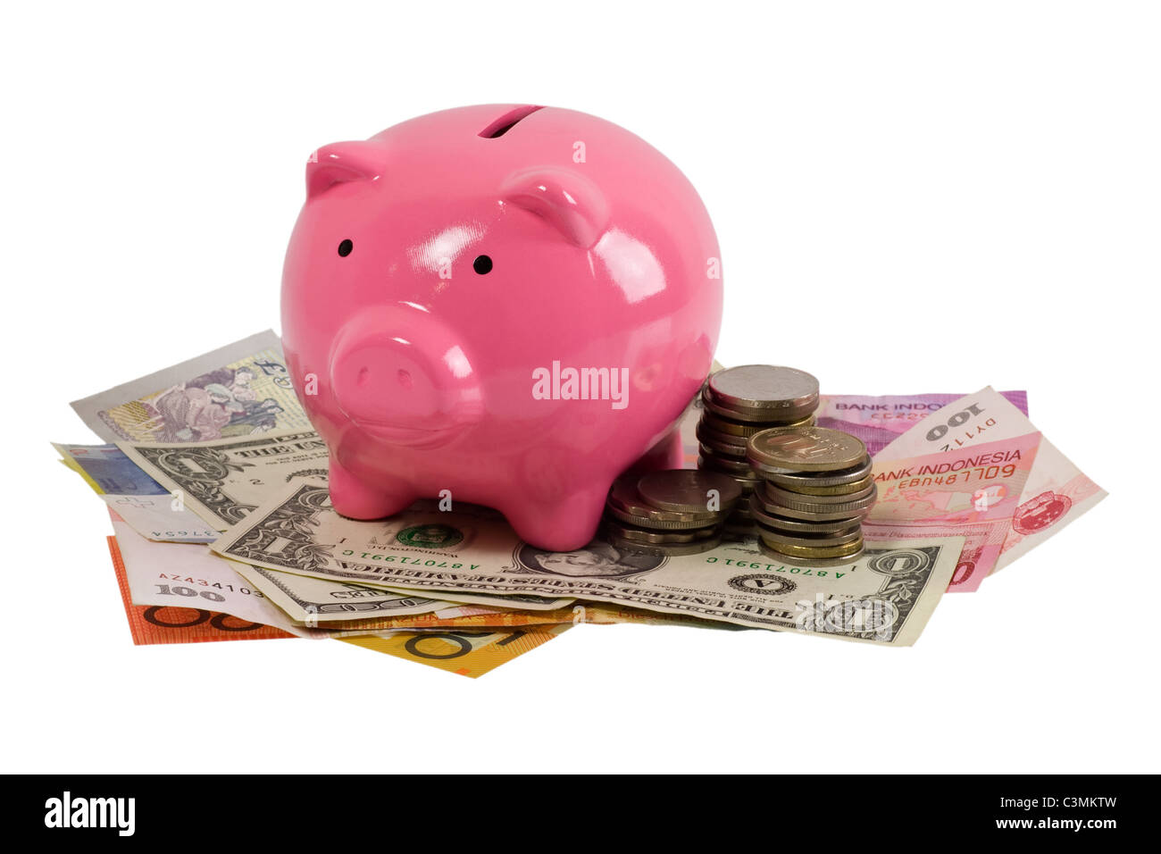 Pink piggy bank on a pile of money isolated on white background Stock ...