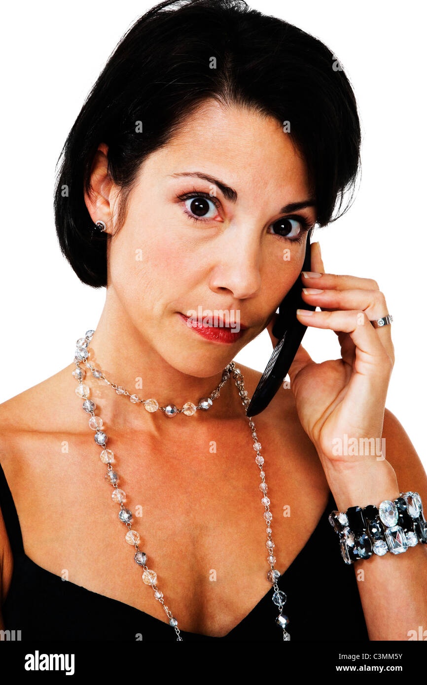 Portrait of a woman talking on a mobile phone isolated over white Stock ...