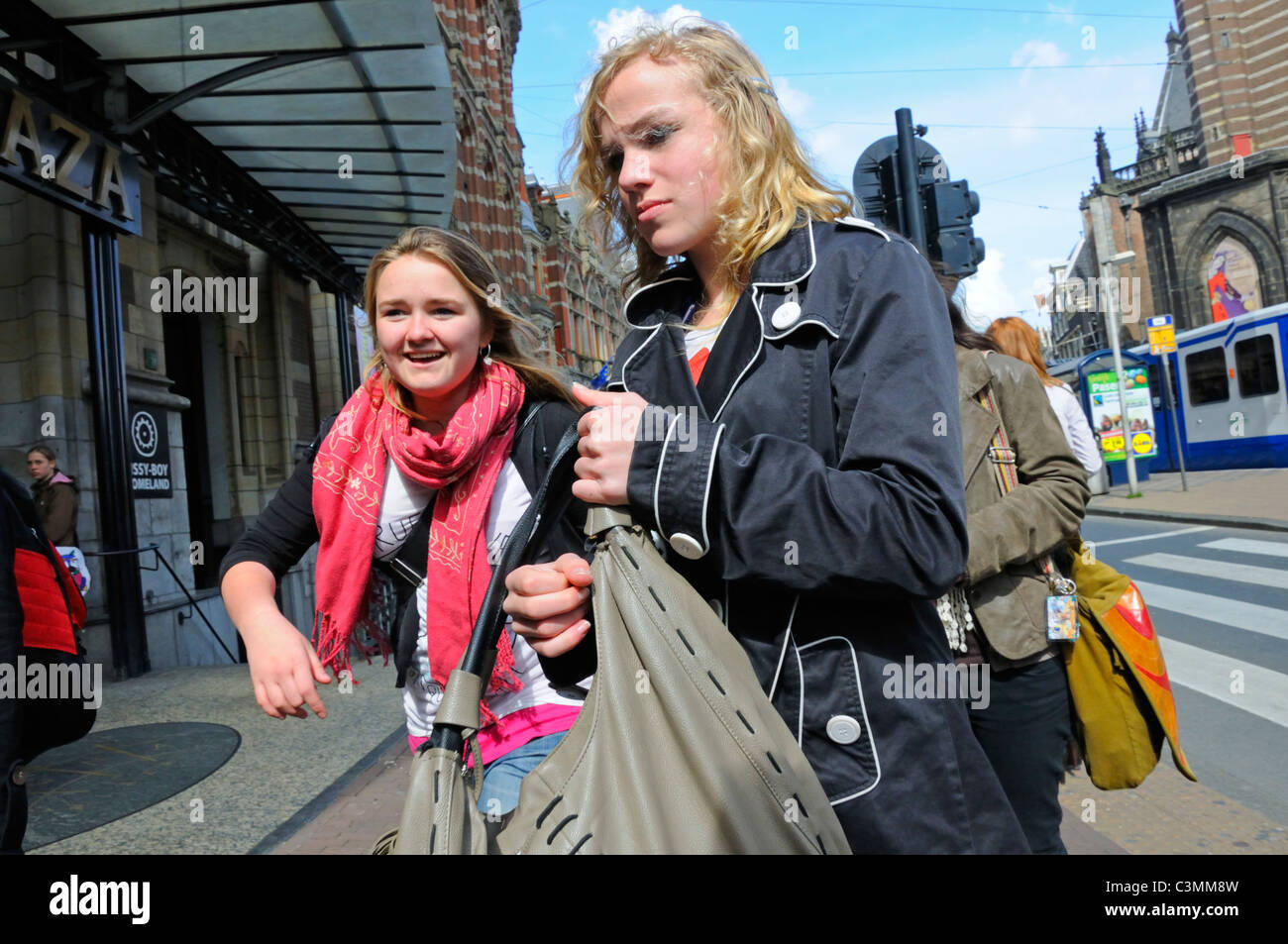 Amsterdam, Netherlands. Two girls crossing the street Stock Photo - Alamy