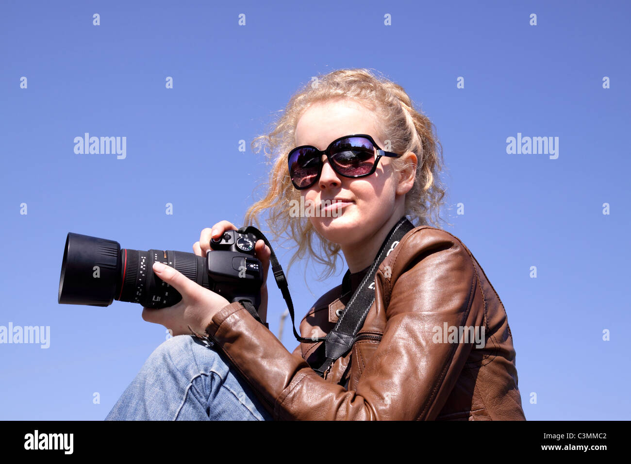 The girl fascinated by photography Stock Photo - Alamy