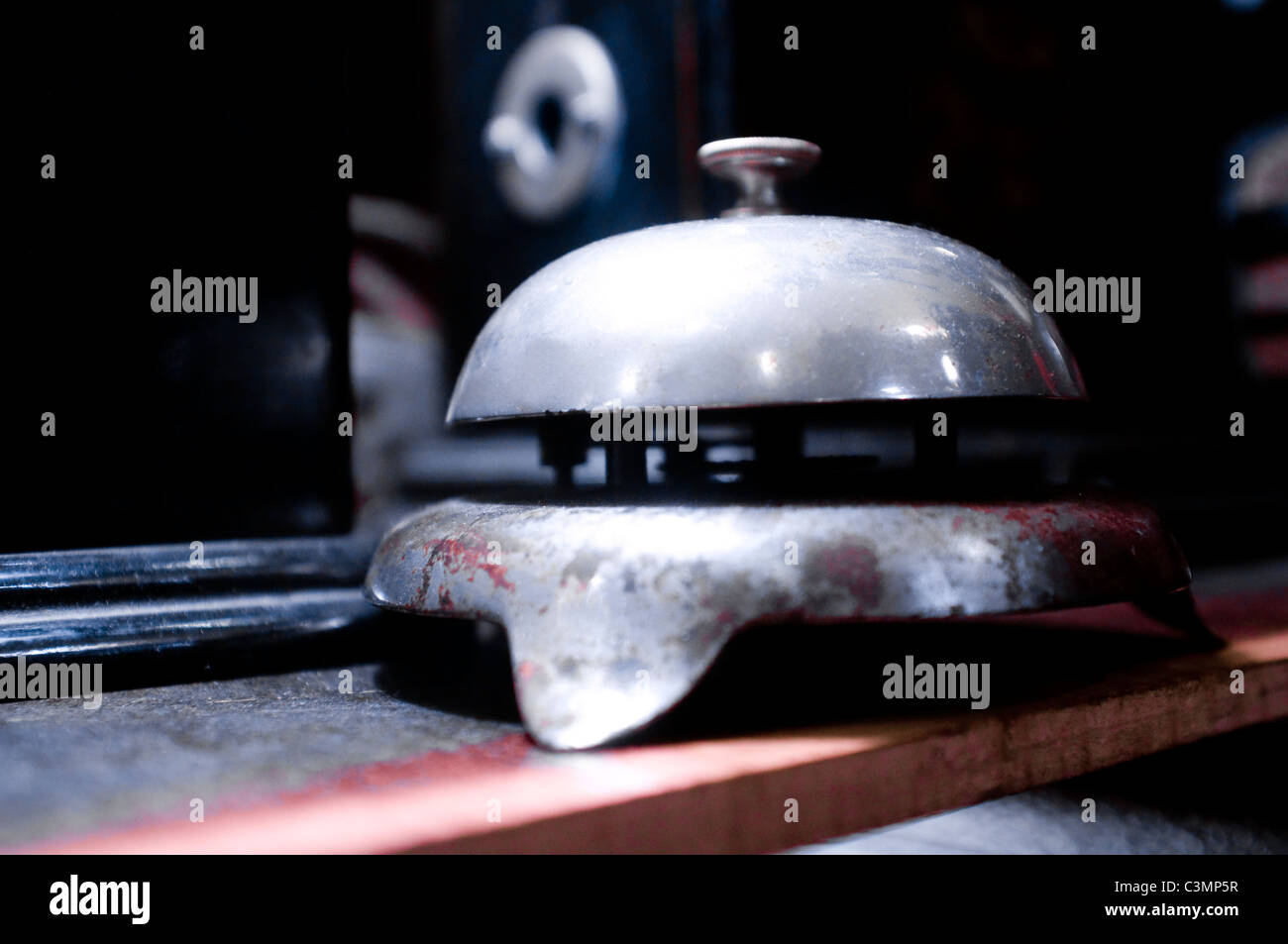 A worn old-fashioned service bell Stock Photo - Alamy
