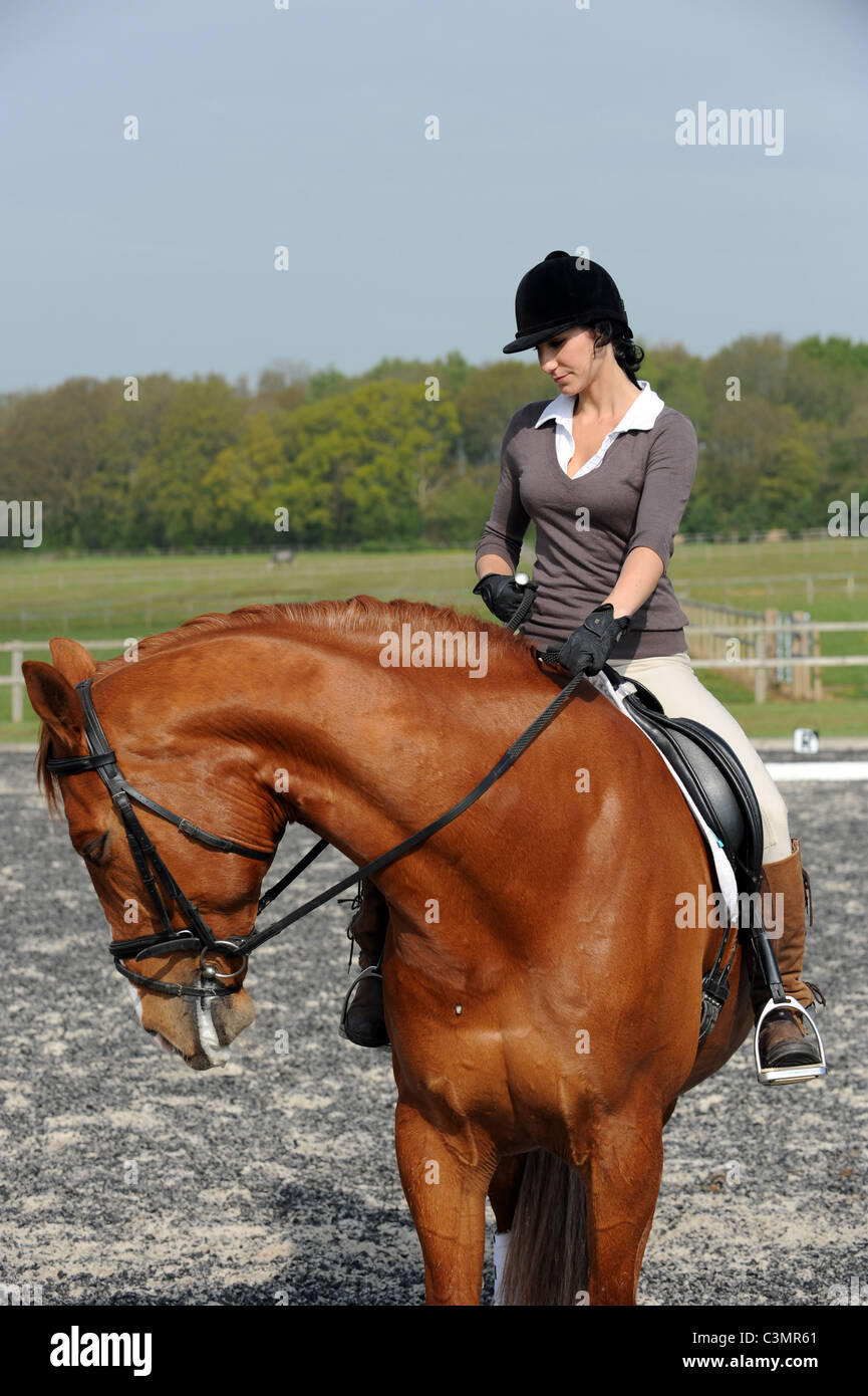 Woman flexing neck horse in hi-res stock photography and images - Alamy