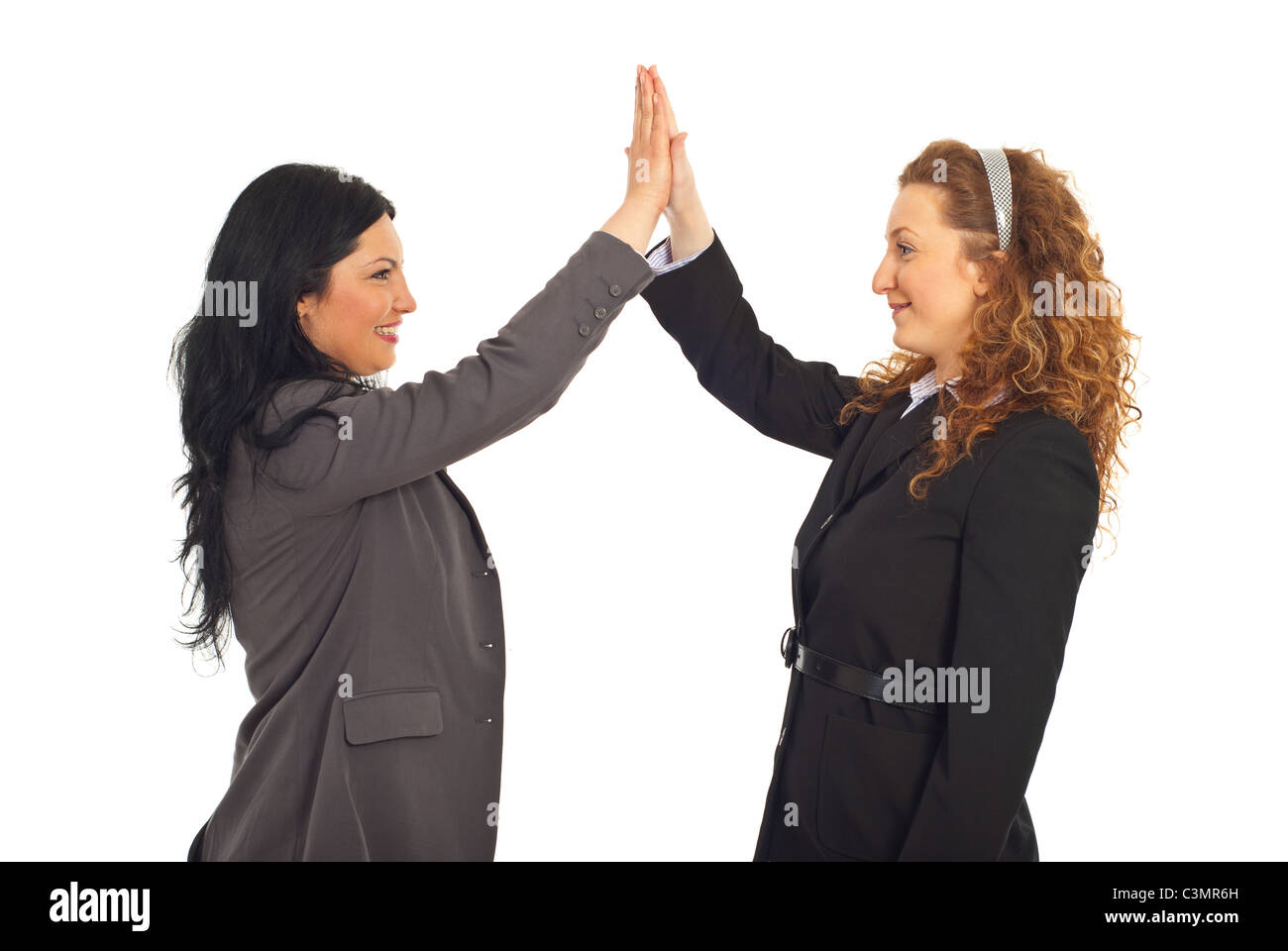 Happy business women giving high five isolated on white background ...