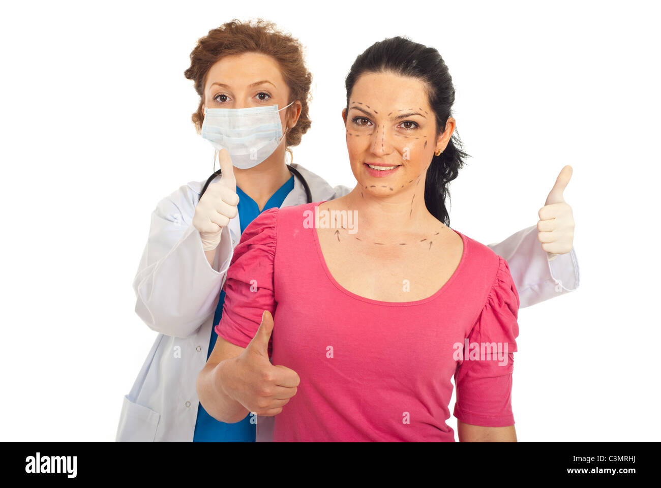 Successful doctor giving thumbs up together with patient woman prepared ...