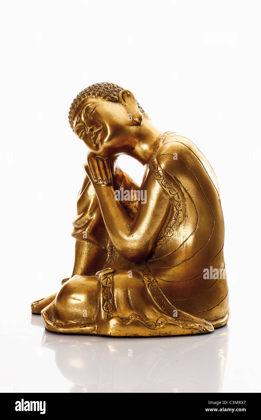 Statue of golden bhudda against white background Stock Photo - Alamy
