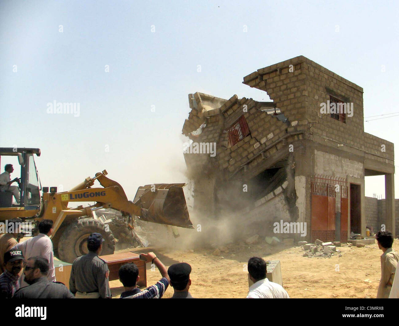 Heavy machinery demolishes illegal construction hi-res stock ...