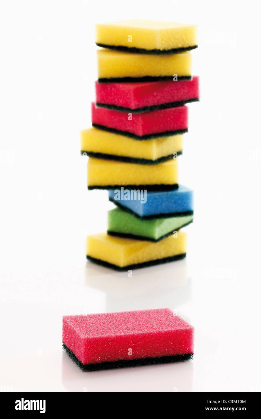 Stack of kitchen sponges against white background Stock Photo - Alamy