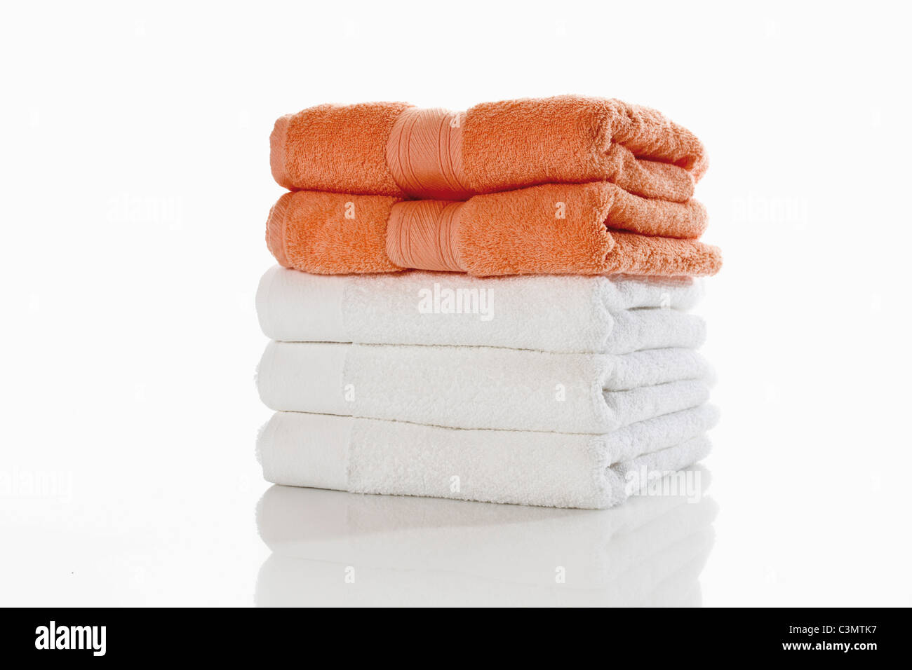 Stack of towels against white background Stock Photo - Alamy