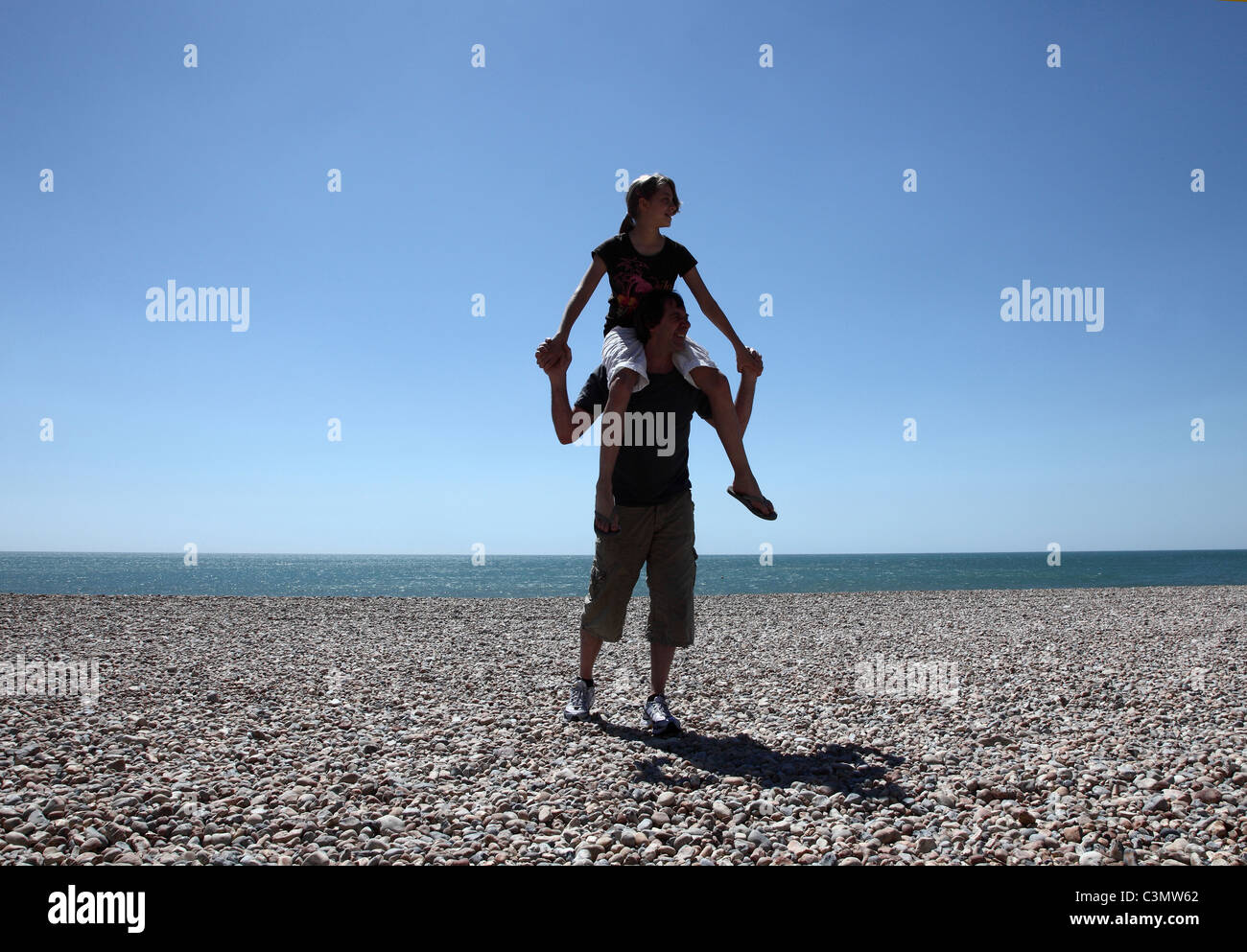 Father Carrying Daughter Shoulders By Sea High Resolution Stock Photography and Images - Alamy