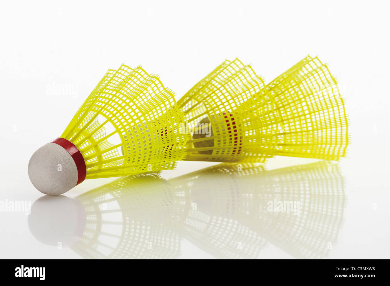 Badminton shuttlecocks on white background Stock Photo - Alamy