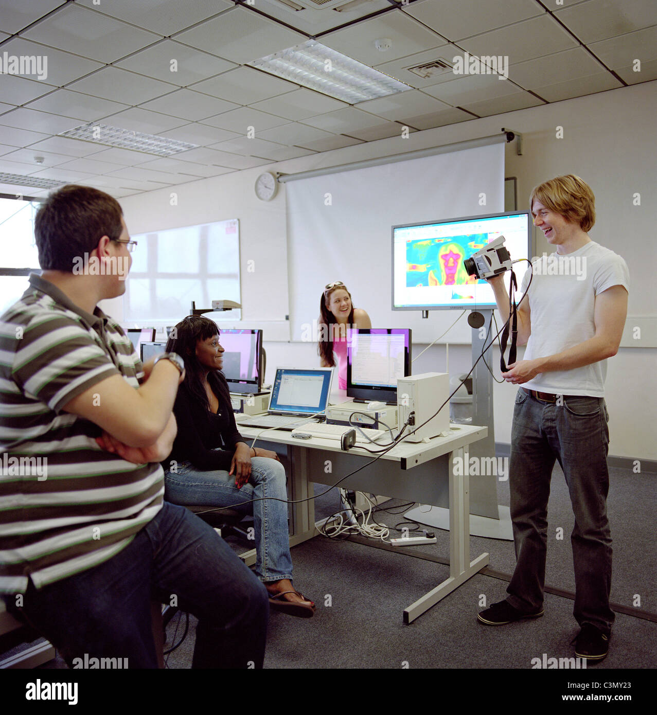 Students or employees learning together Stock Photo - Alamy