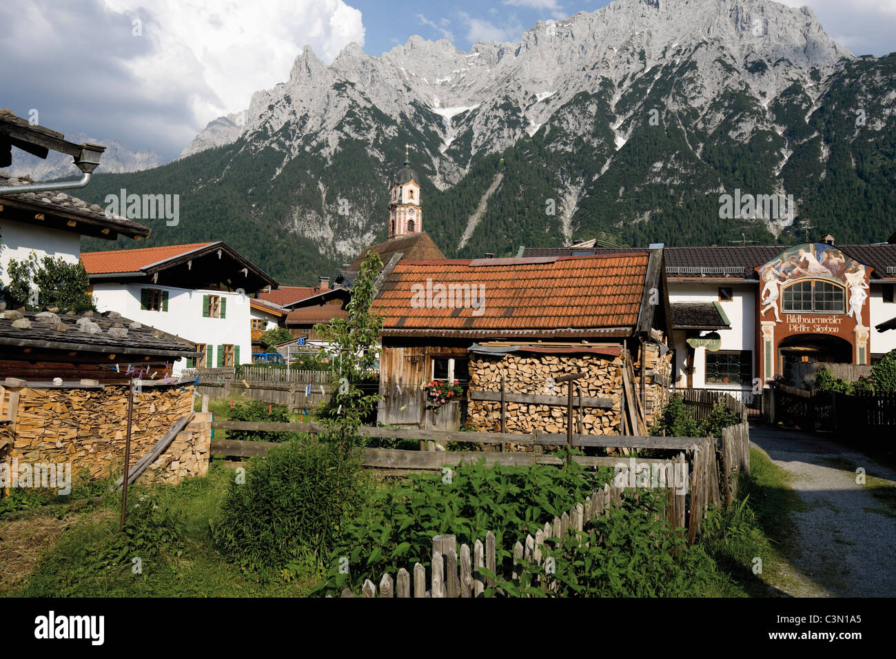Germany, Bavaria, Mittenwald, View of village with mountain in ...
