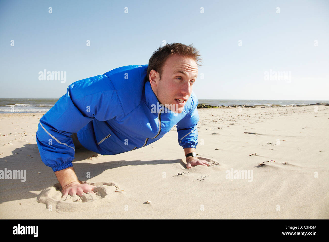 Beach man pushup hi-res stock photography and images - Alamy