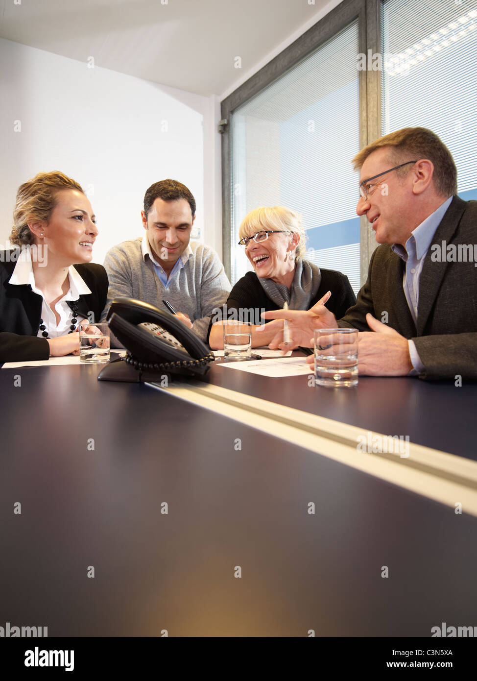Conference call in a group meeting Stock Photo - Alamy
