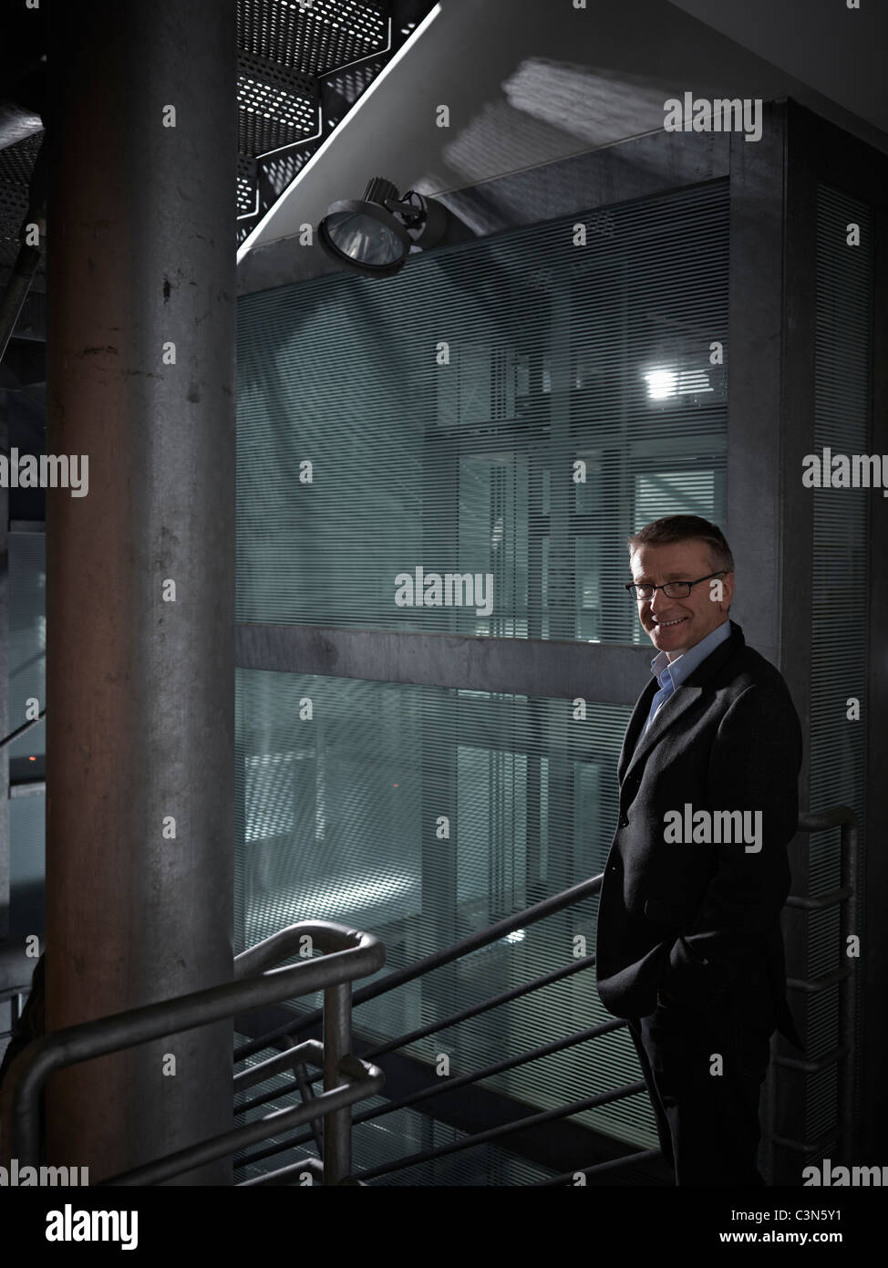 Business man leaving the office late Stock Photo - Alamy