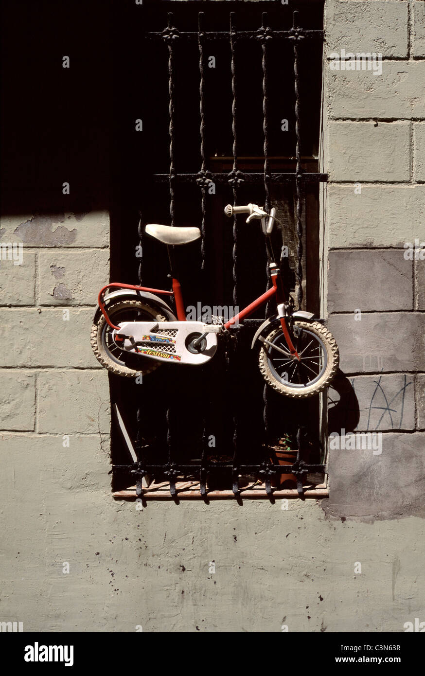Small bike on a window Stock Photo - Alamy
