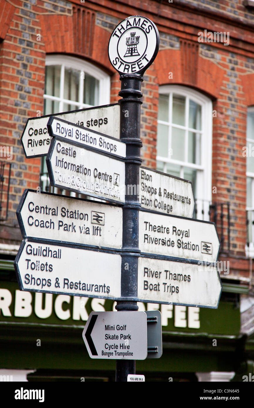 A signpost showing the way to various tourist attractions in Windsor ...