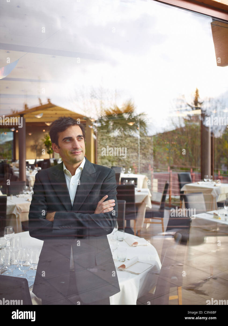 Mid adult man waiting in restaurant hi-res stock photography and images ...