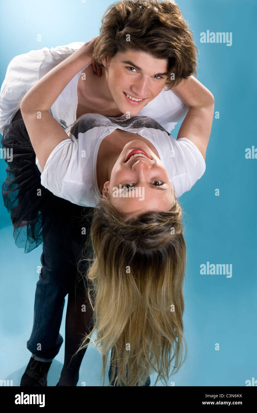 Happy young couple bend together embrac Stock Photo - Alamy
