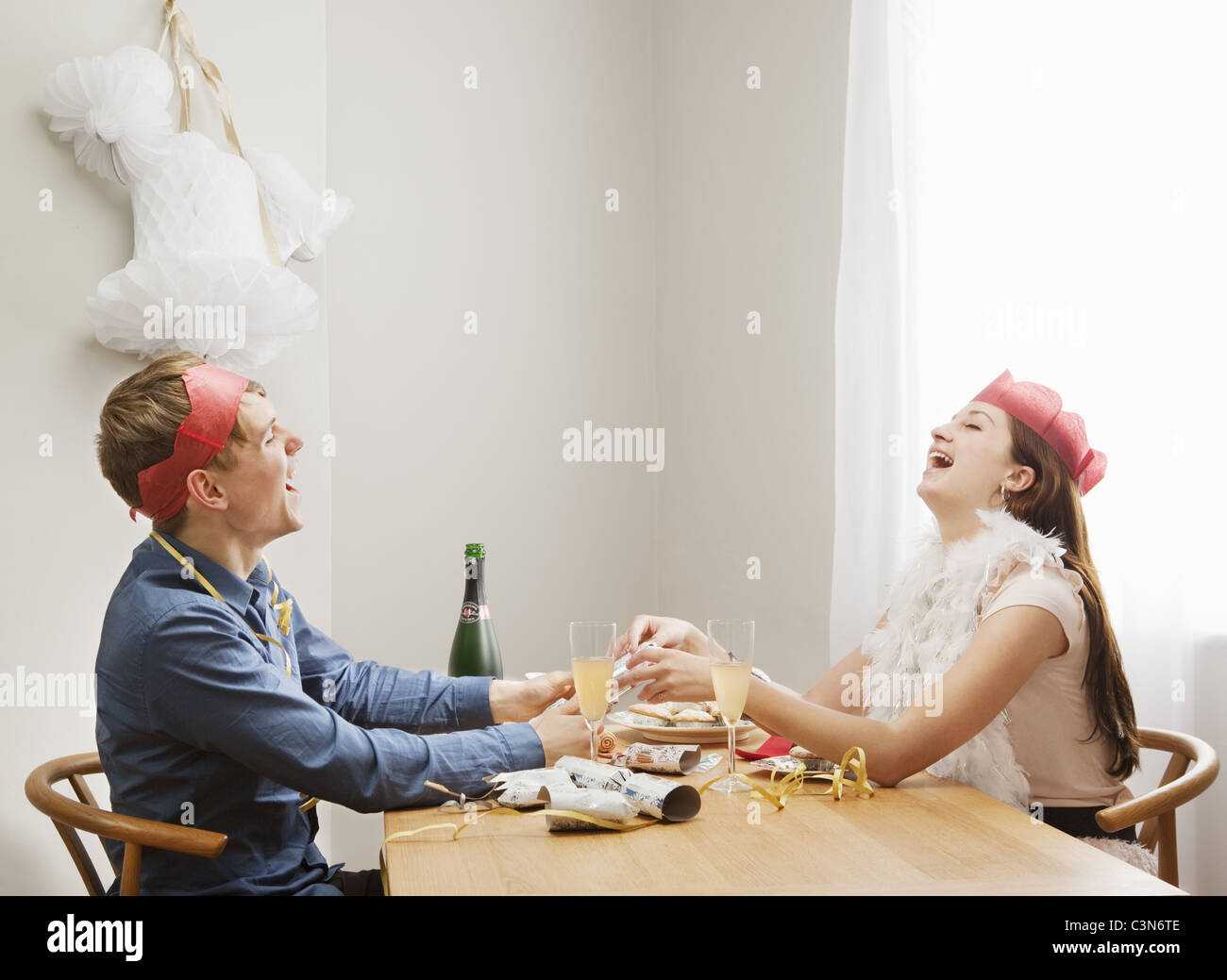 People Pulling Cracker Stock Photos & People Pulling Cracker Stock ...