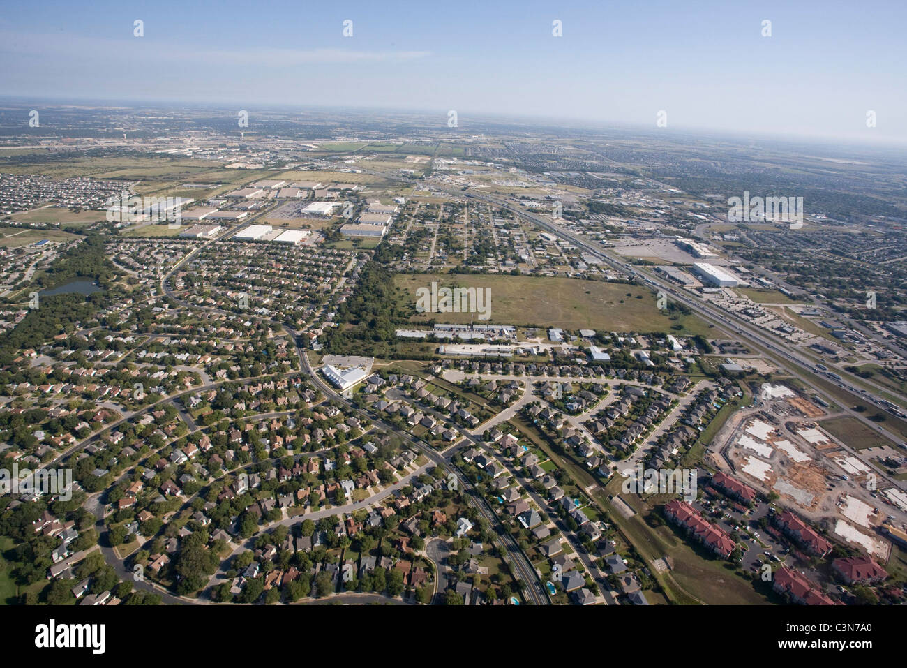 Aerials made from a helicopter showing suburban growth in the suburbs ...