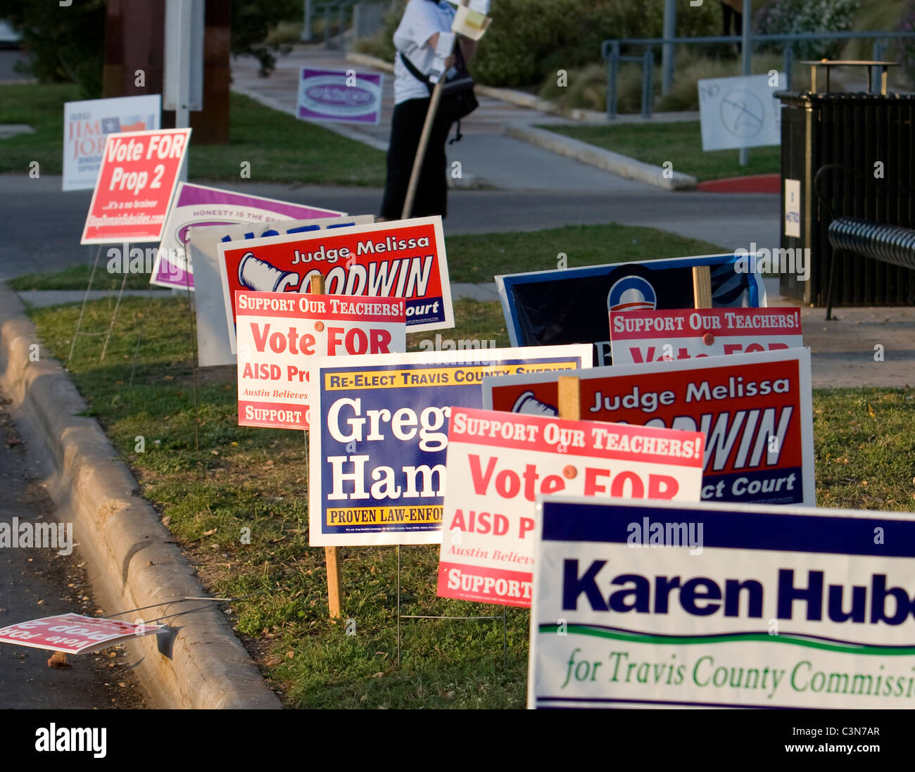 Campaign signs line street in front of polling place on election day in ...
