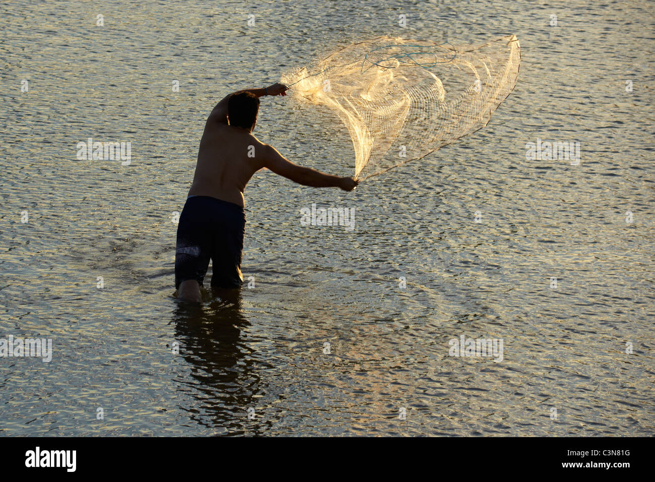 Throwing cast net hi-res stock photography and images - Alamy