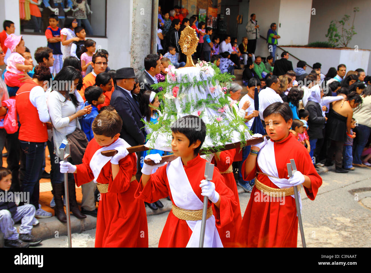 Four children holding a religious image referring to the Holy Week in a ...