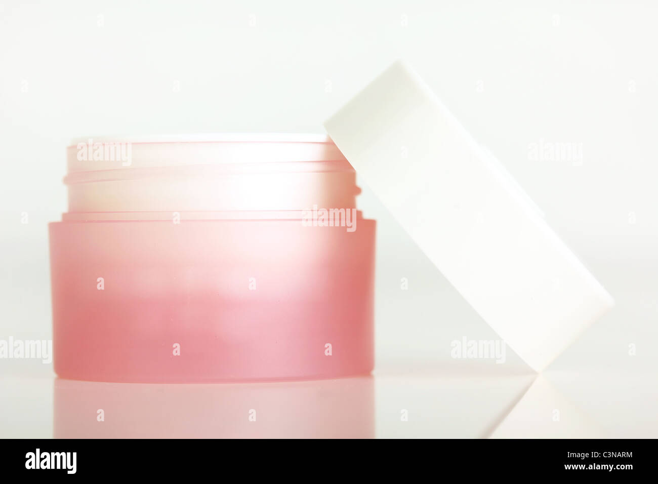 Lip balm in round box, closeup on white Stock Photo - Alamy