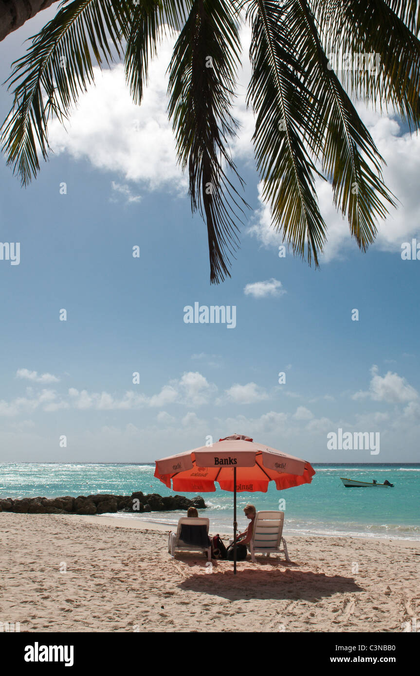 Beach umbrella, Carib Beach Barbados, Caribbean Stock Photo - Alamy