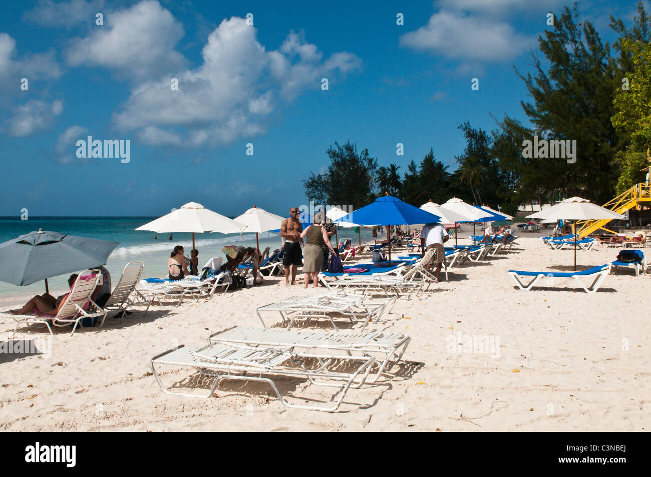 Beach umbrellas Carib Beach, Barbados, Caribbean Stock Photo - Alamy