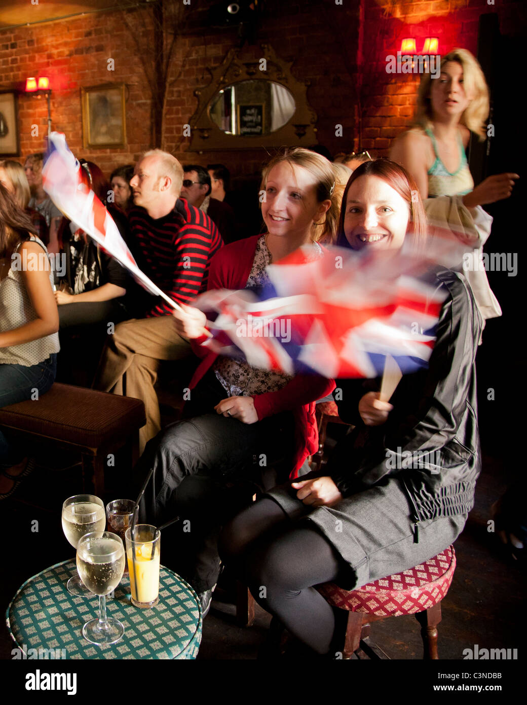 People waving union jack flags hi-res stock photography and images - Alamy