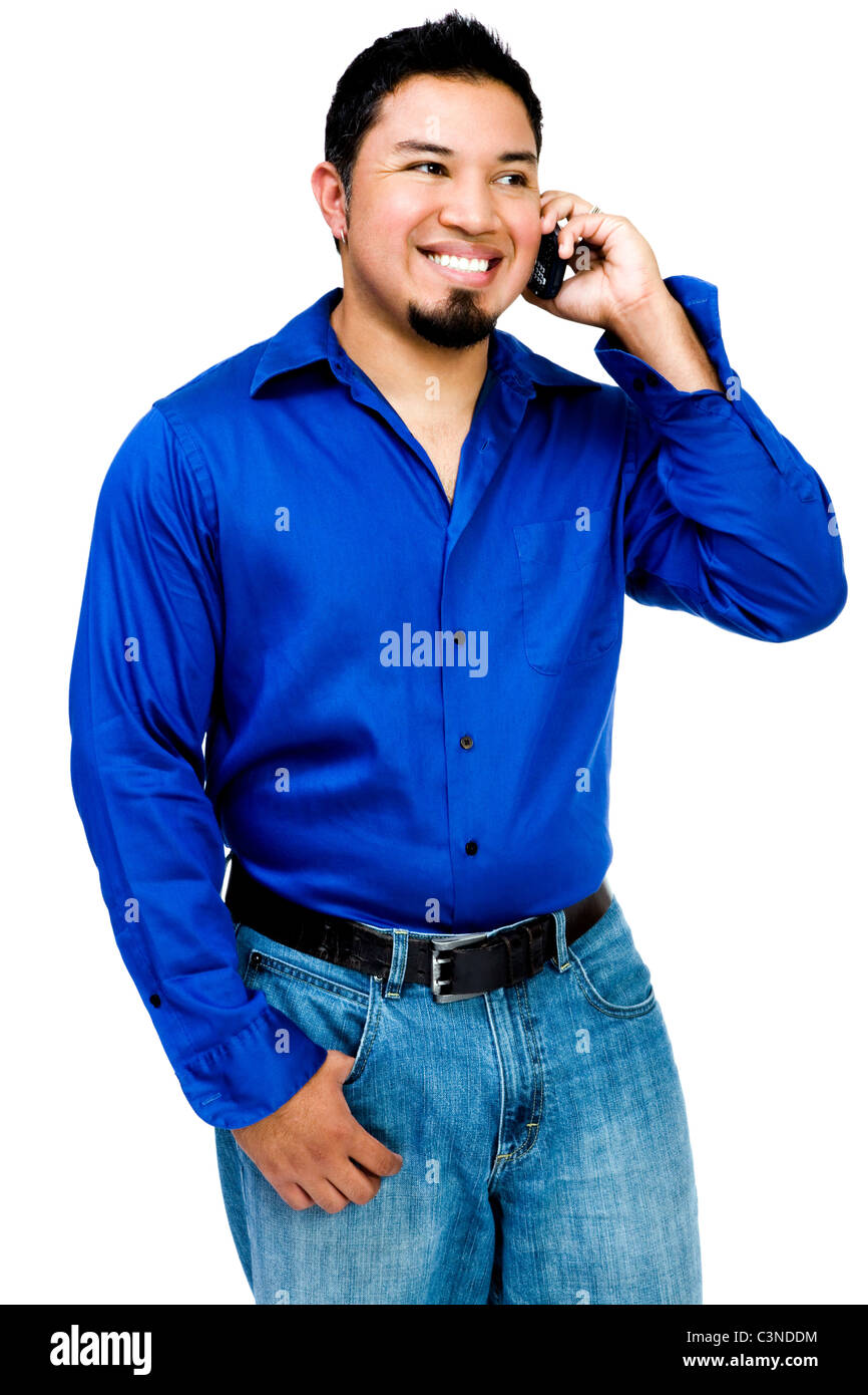 Latin American man talking on a mobile phone isolated over white Stock ...