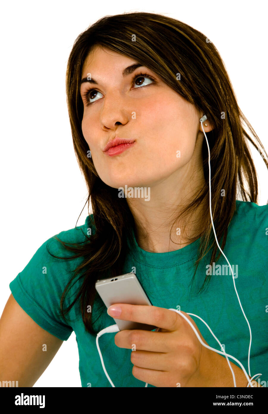 Fashion model listening to music on a MP3 player isolated over white ...