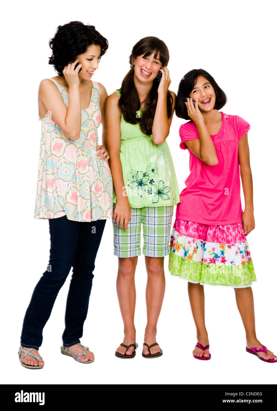 Smiling family talking on mobile phones isolated over white Stock Photo ...