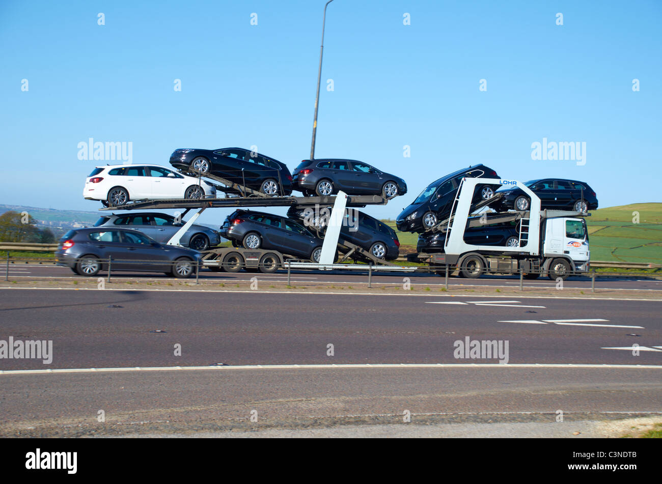 car transporter on motorway Stock Photo - Alamy