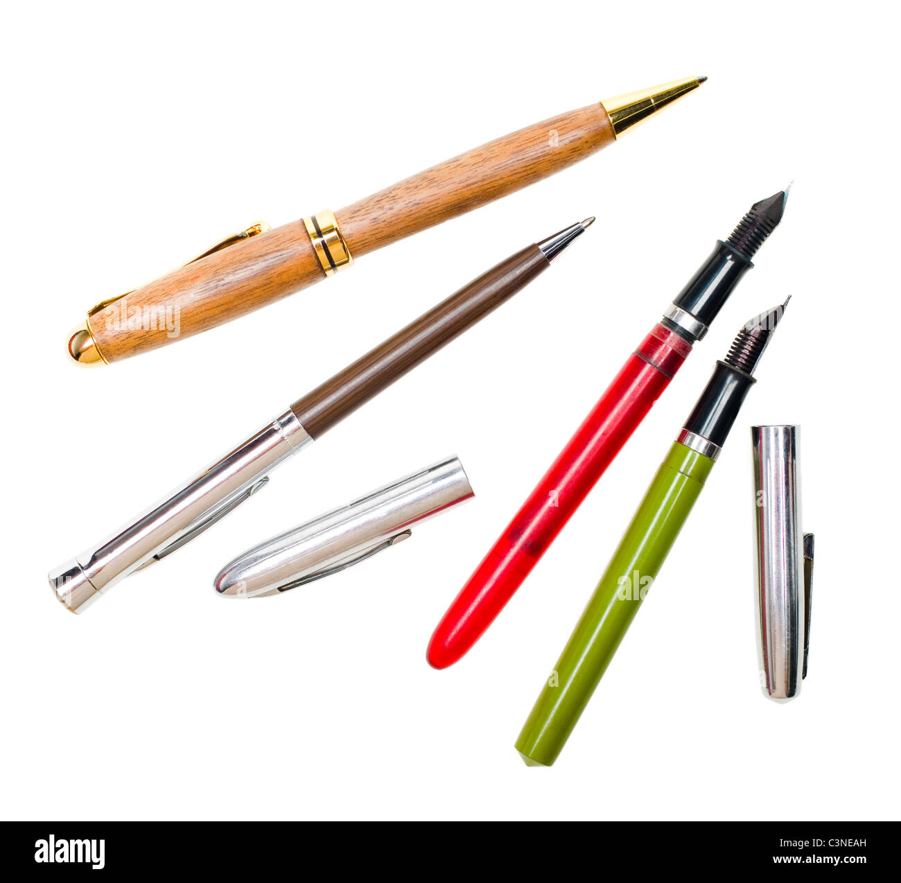 Four assorted pens isolated over white Stock Photo - Alamy